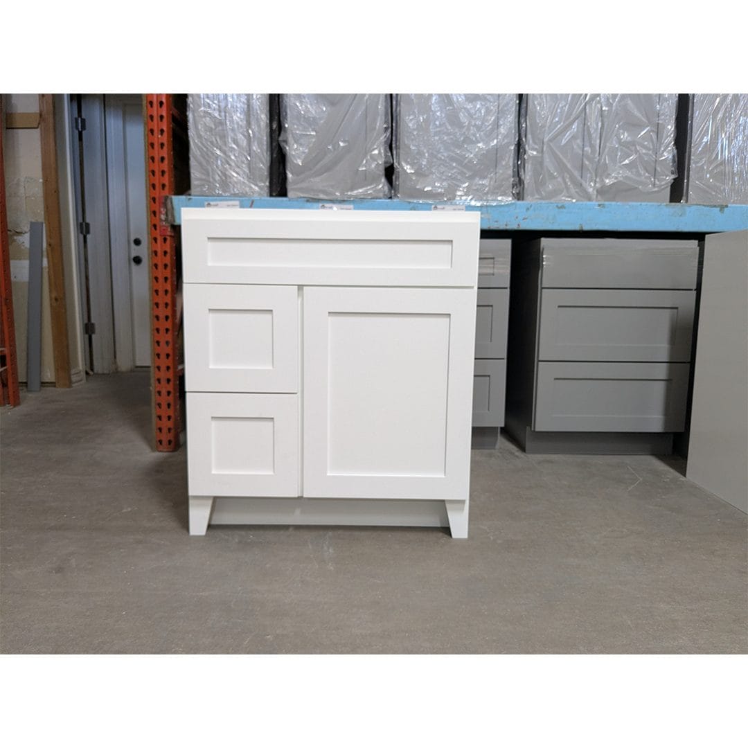 30 DRAWER LEFT WHITE SHAKER FEET VANITY - Builders Surplus Yeehaa